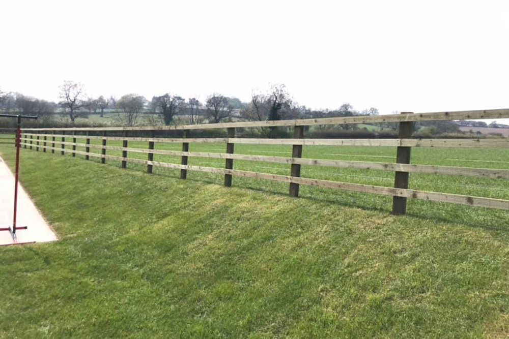 HC4 posts and motorway rails around a barn | MJB Fencing Limited