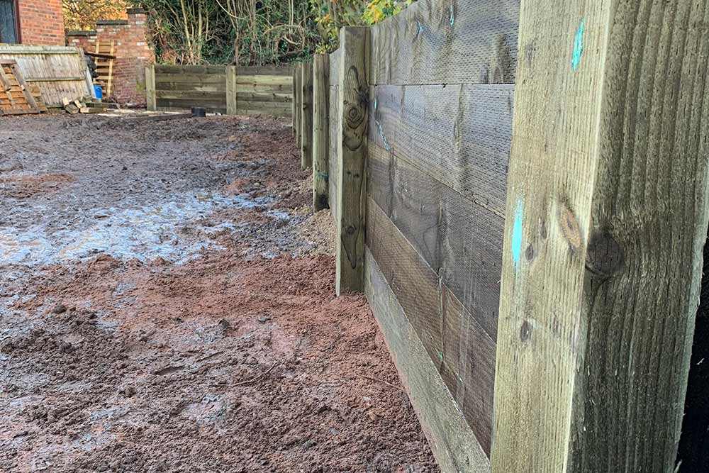Retaining sleeper wall | MJB Fencing Limited
