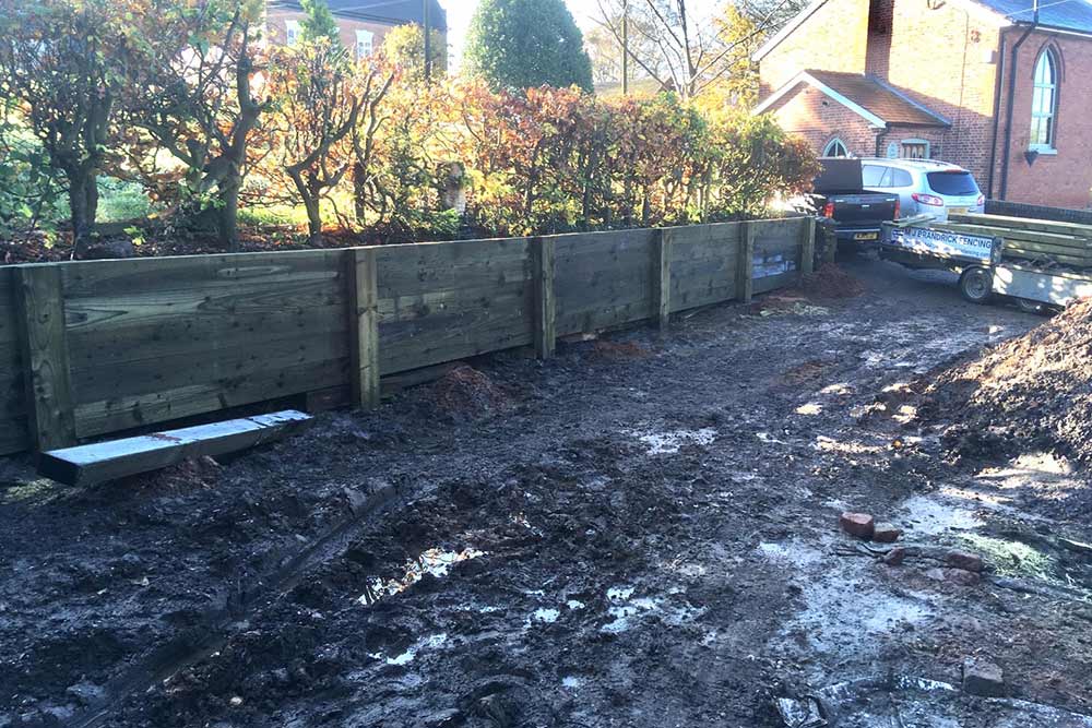 Retaining sleeper wall | MJB Fencing Limited